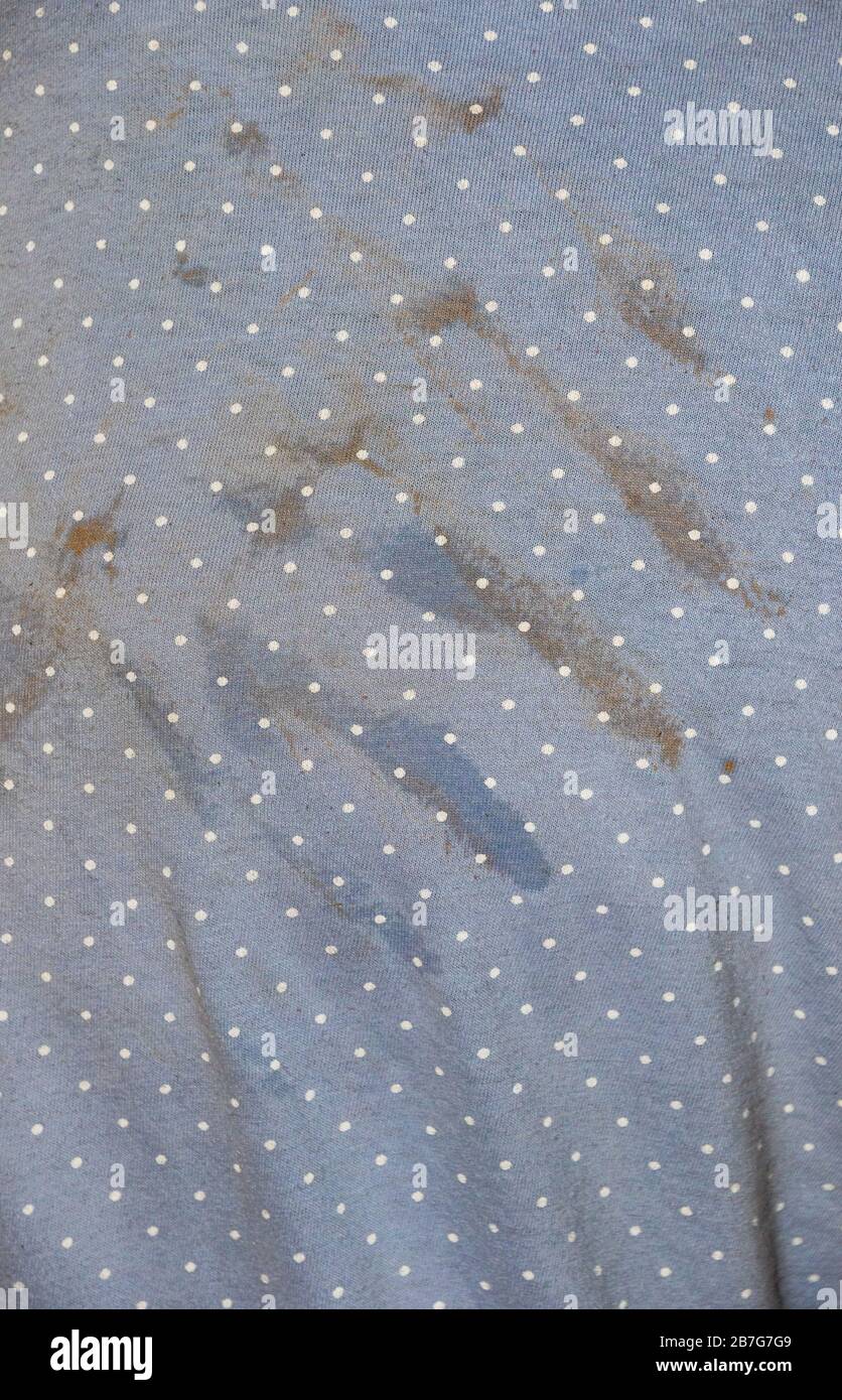 Image for background use a dull blue fabric surface with small white ...