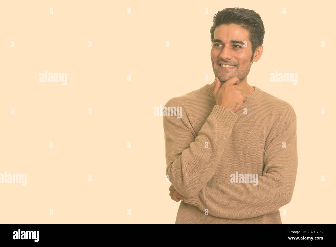 Portrait of happy handsome Persian man thinking Stock Photo - Alamy