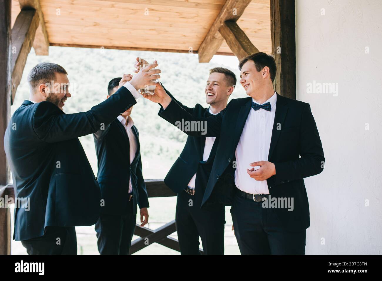 The groom and his friends celebrate the wedding. Men in suits. Murzhsky ...