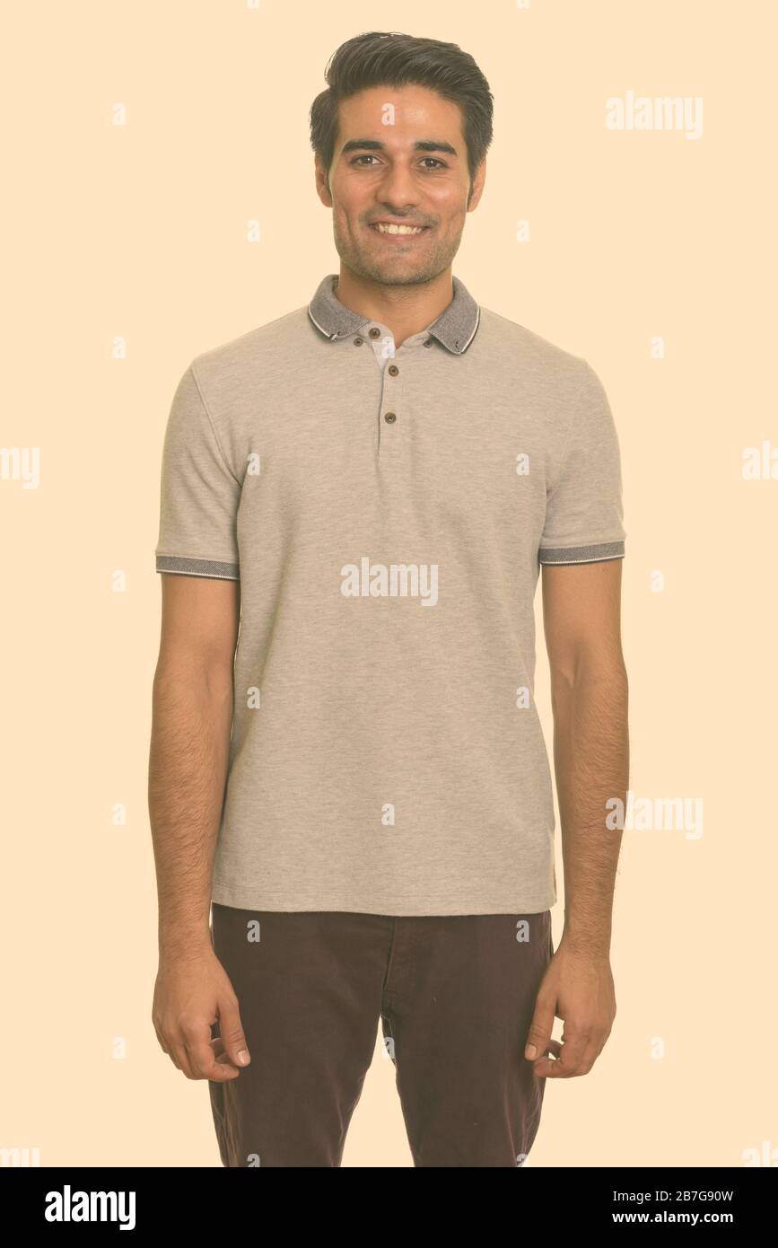 Portrait of happy handsome Persian man smiling Stock Photo - Alamy