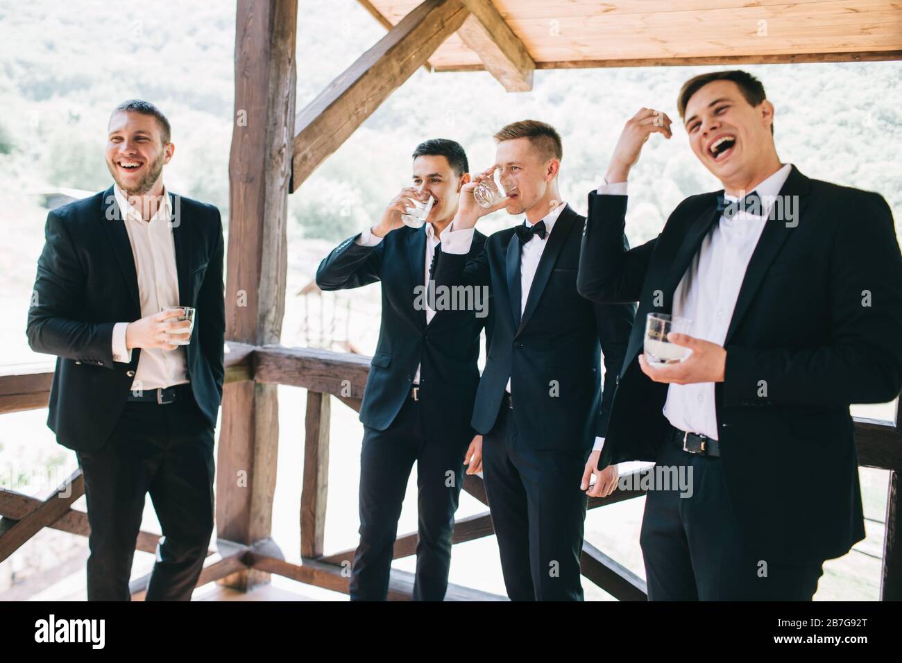 The groom and his friends celebrate the wedding. Men in suits. Murzhsky ...