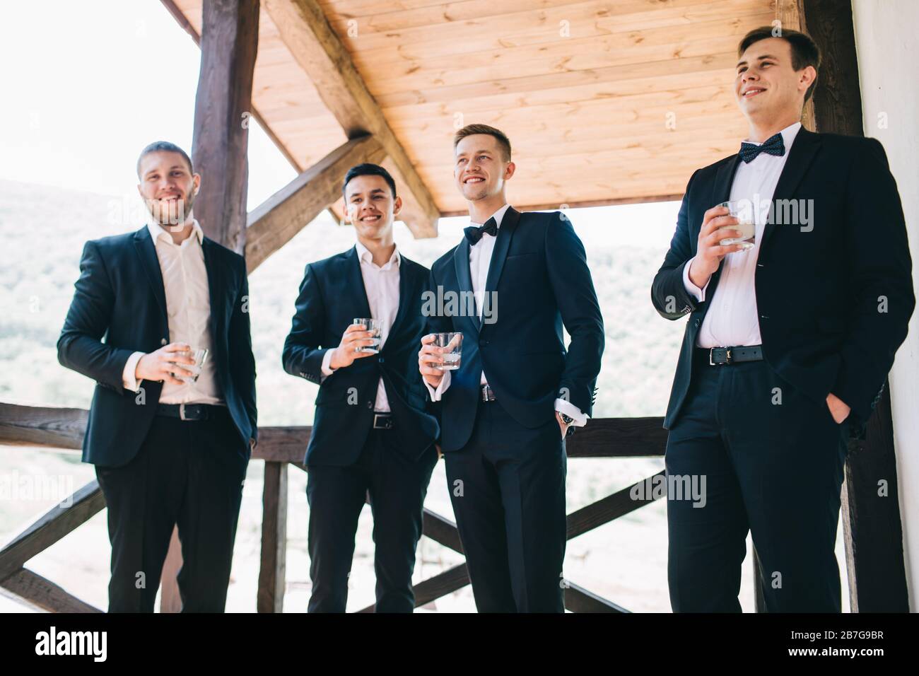 The groom and his friends celebrate the wedding. Men in suits. Murzhsky ...