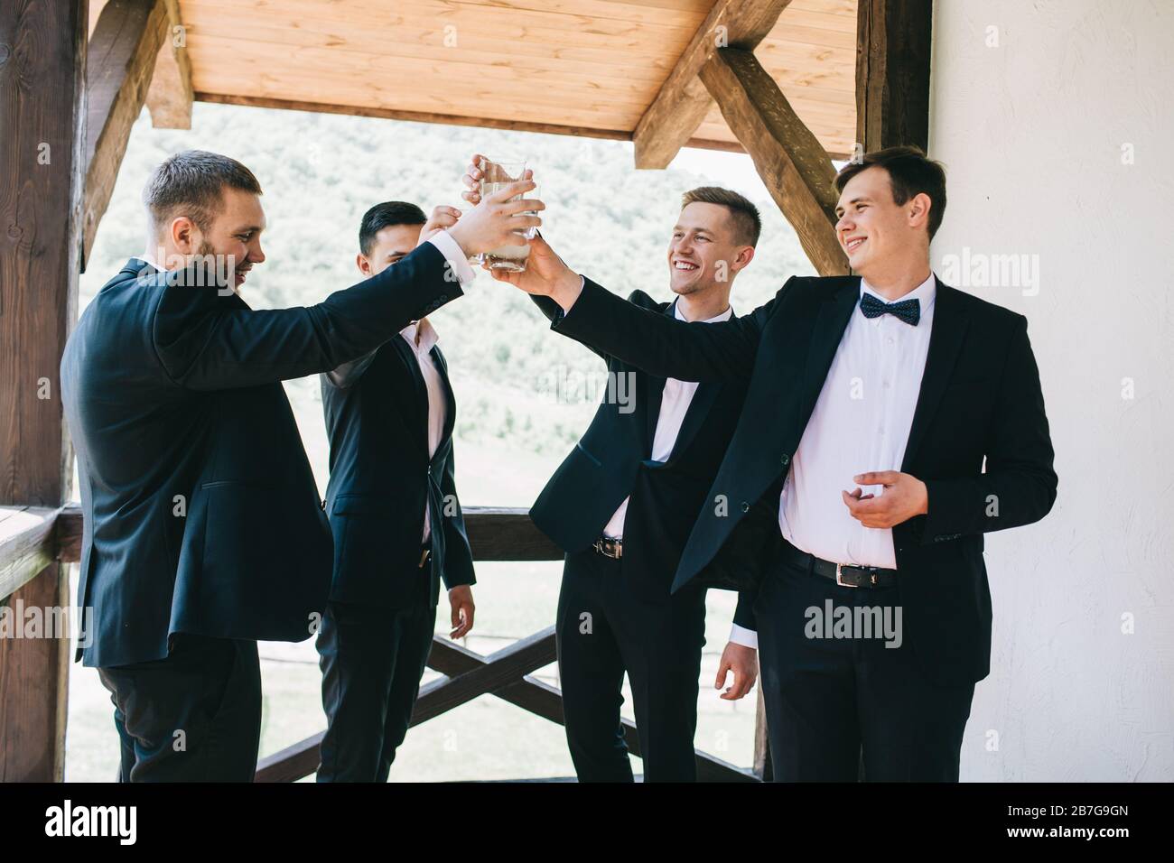 The groom and his friends celebrate the wedding. Men in suits. Murzhsky ...