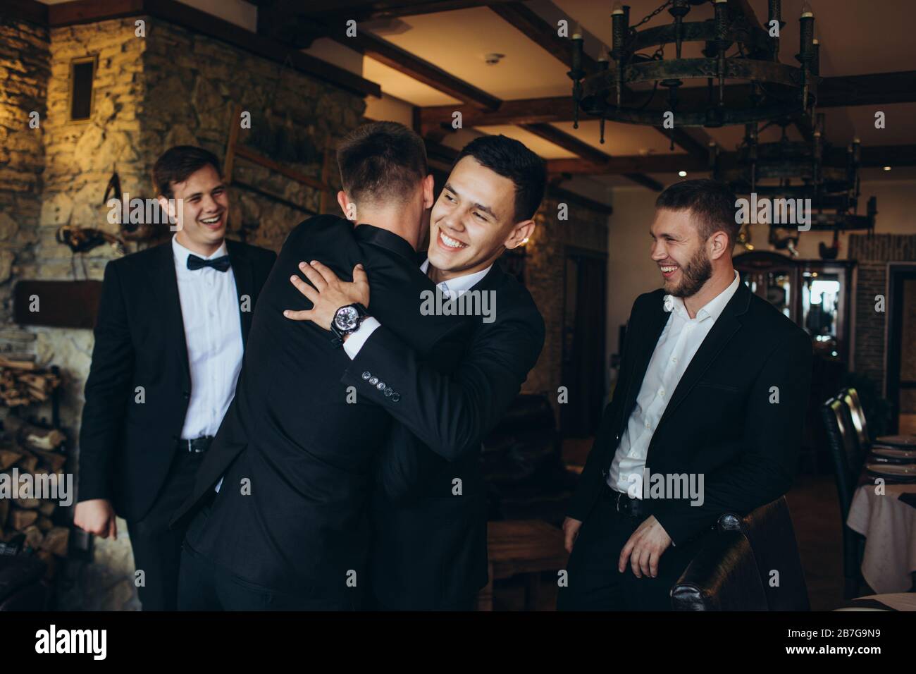 The groom and his friends celebrate the wedding. Men in suits. Murzhsky ...