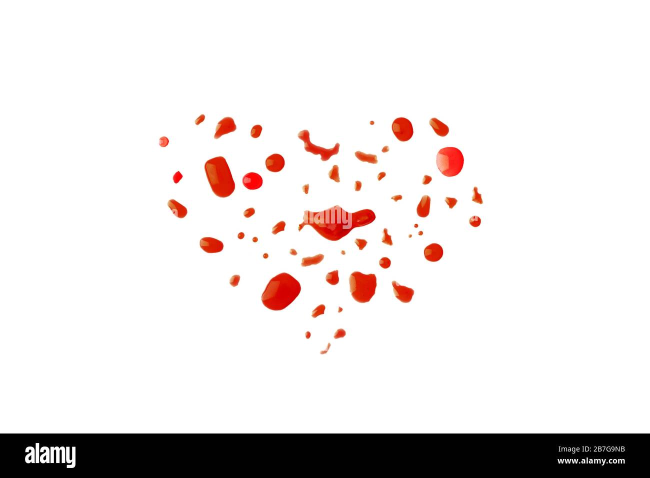 heart shape from red liquid droplets. love symbol drops of red juice on ...