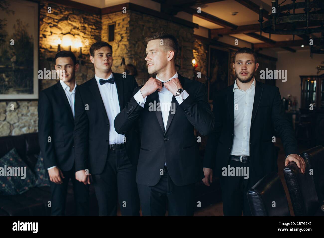 The groom and his friends celebrate the wedding. Men in suits. Murzhsky ...