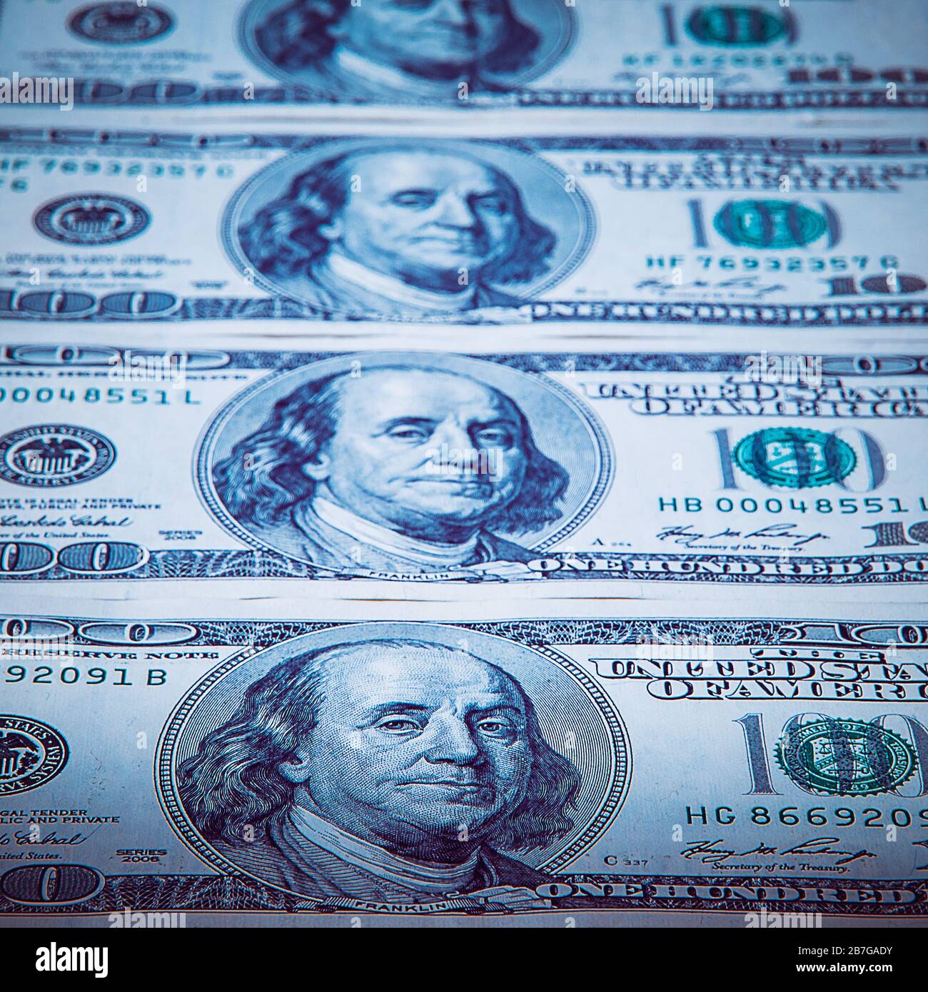 The background of a one hundred dollar bill. Style blue light Stock ...