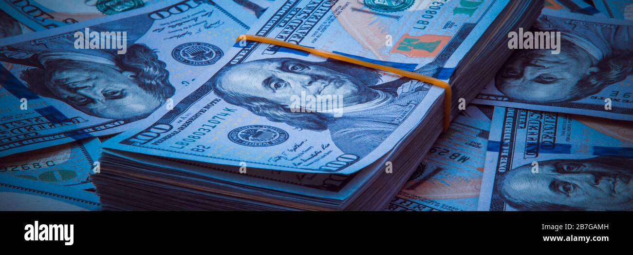 The background of a one hundred dollar bill. Style blue light Stock ...