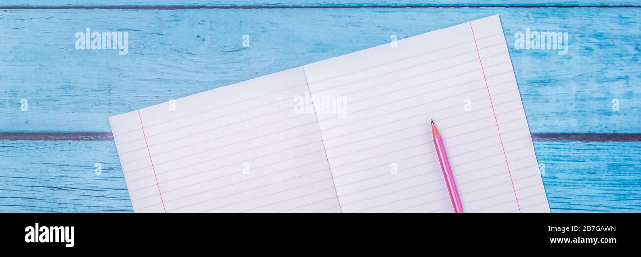 Notepad with pencil on wood board background.using wallpaper for ...