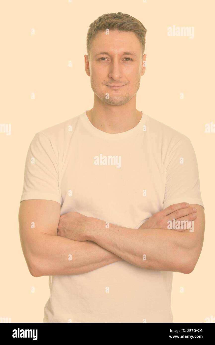 Portrait of handsome man with arms crossed Stock Photo - Alamy