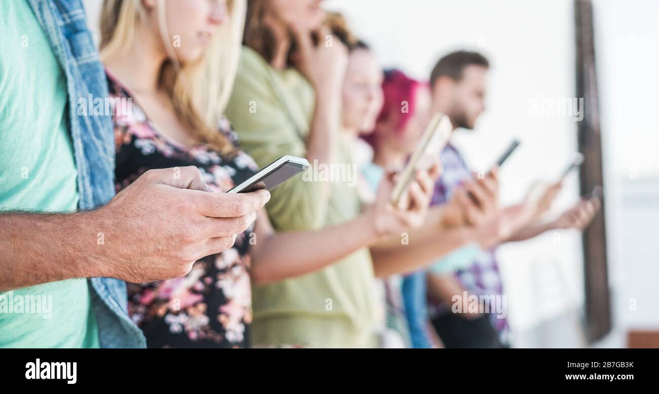 Group of students friends using smartphones outdoor - Young people ...