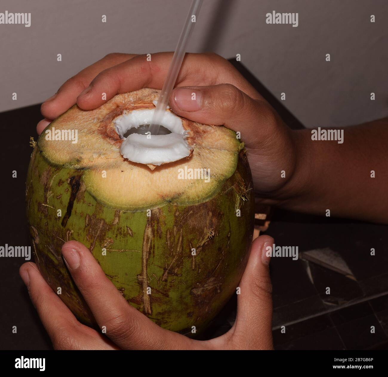 Fresh Tender Coconut drink with straw also called as Daav or Nariyal ...
