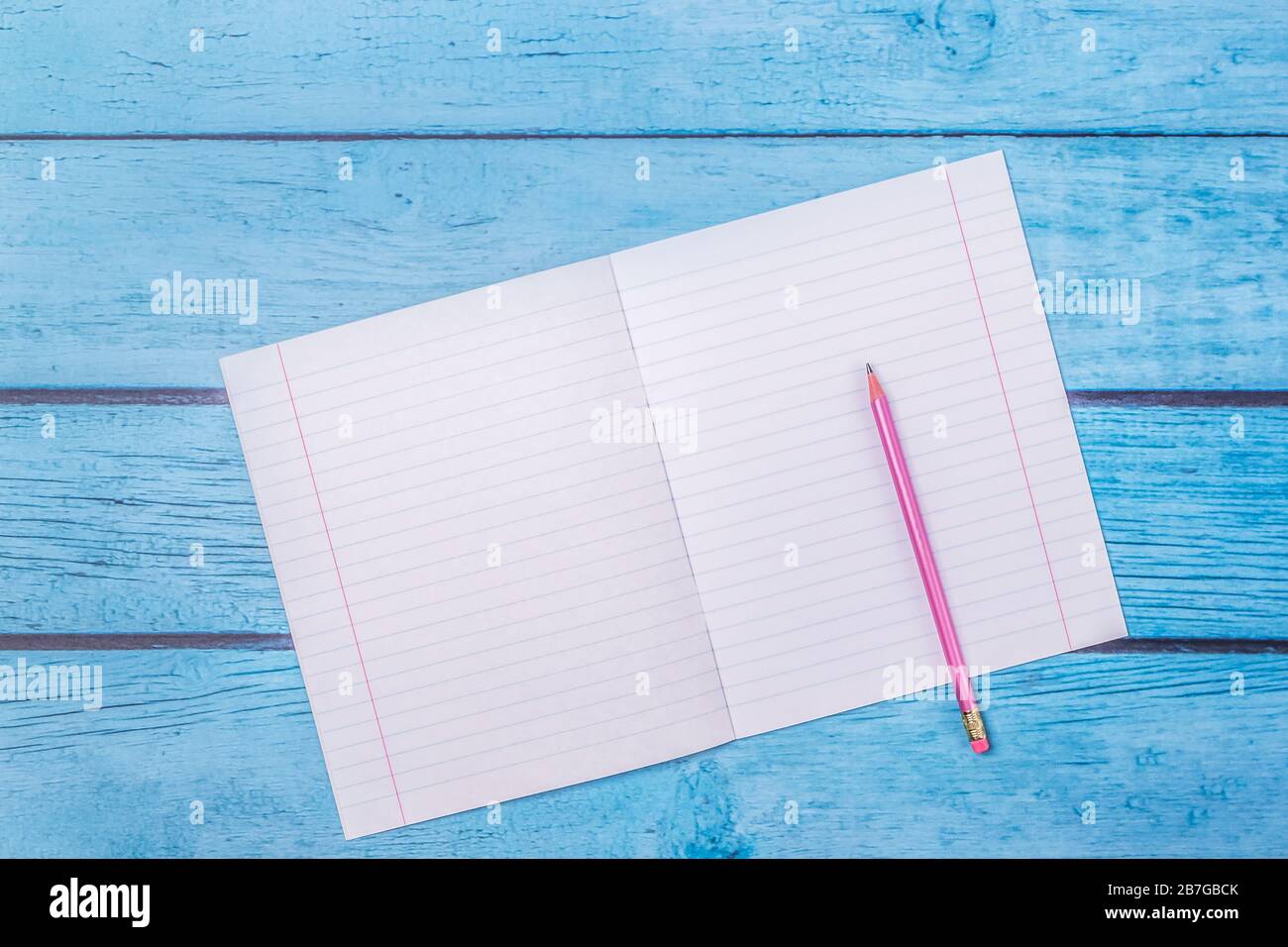 Notepad with pencil on wood board background.using wallpaper for ...