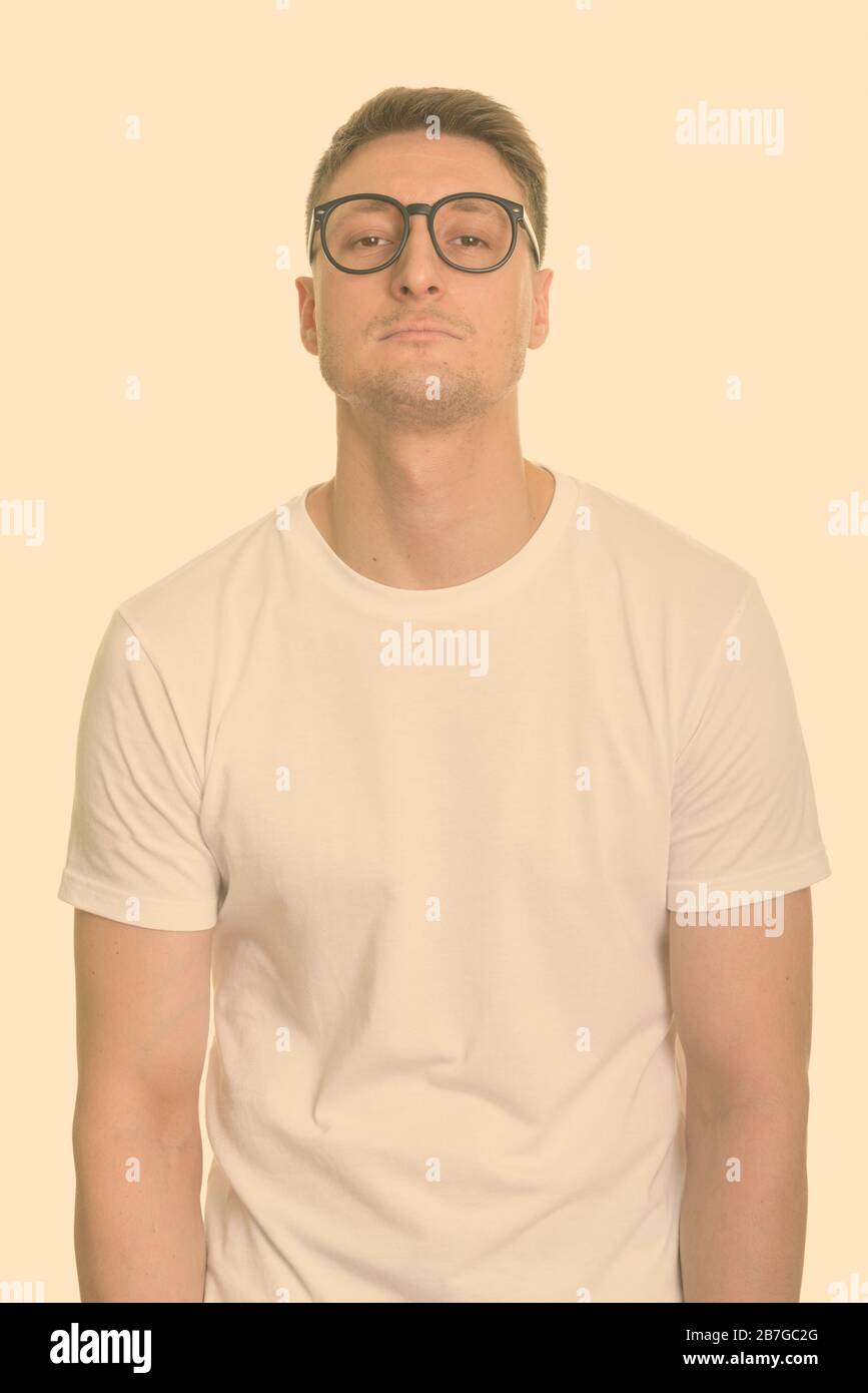 Portrait of stressed nerd man with eyeglasses looking tired Stock Photo ...