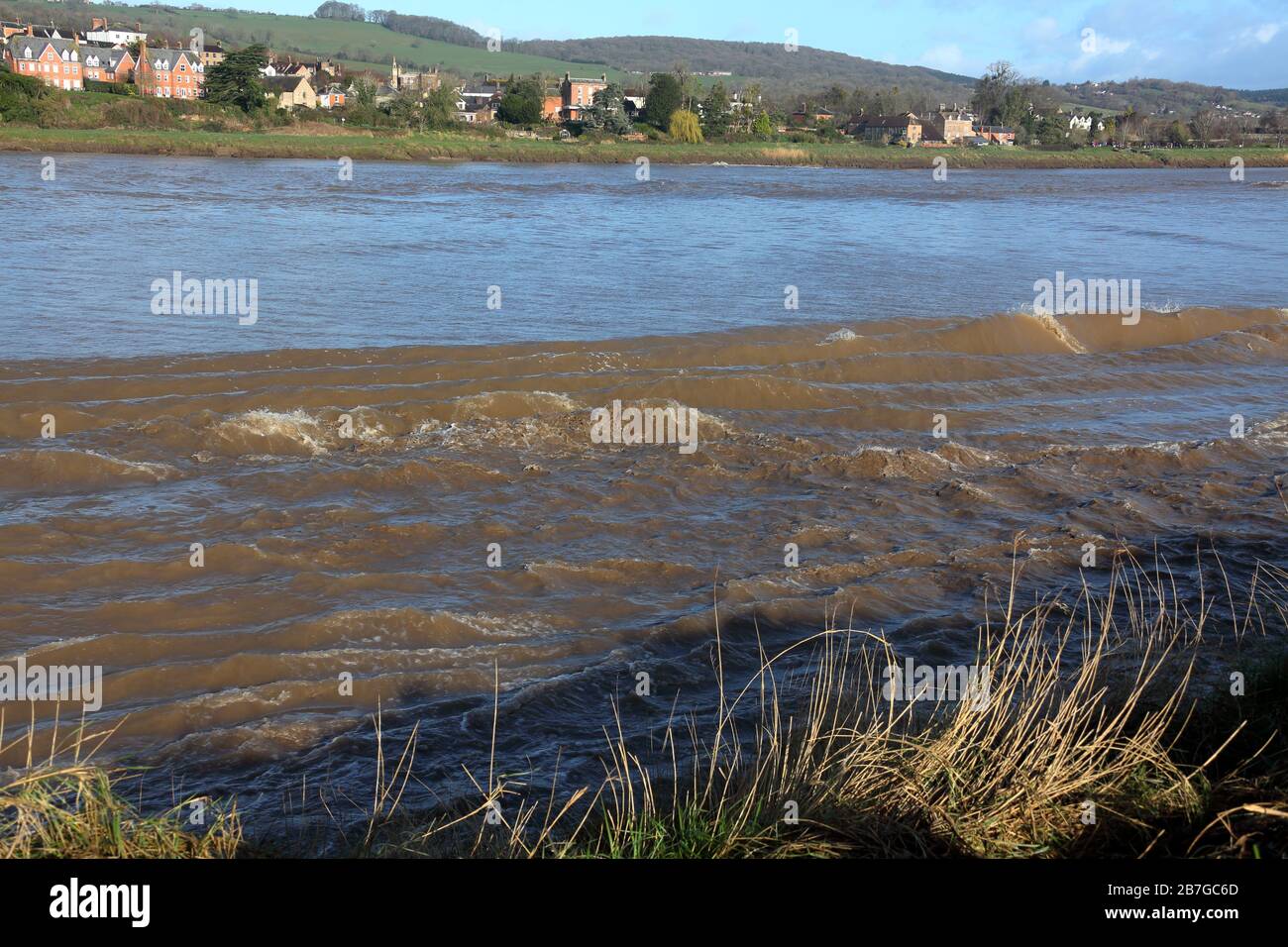 The Severn river Bore barrelling along an already swollen water of the ...