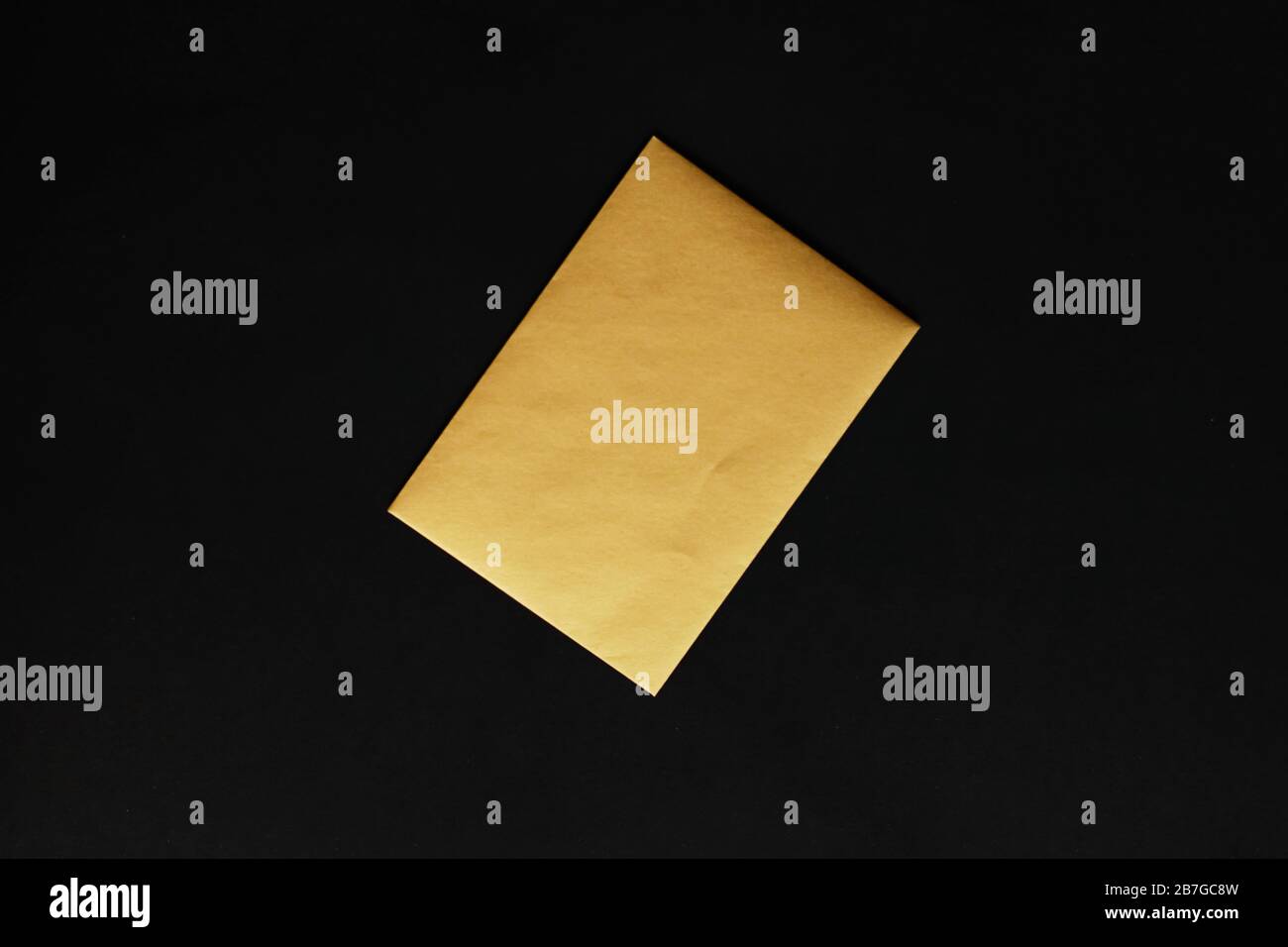 Blank golden paper card on black background, premium business and ...