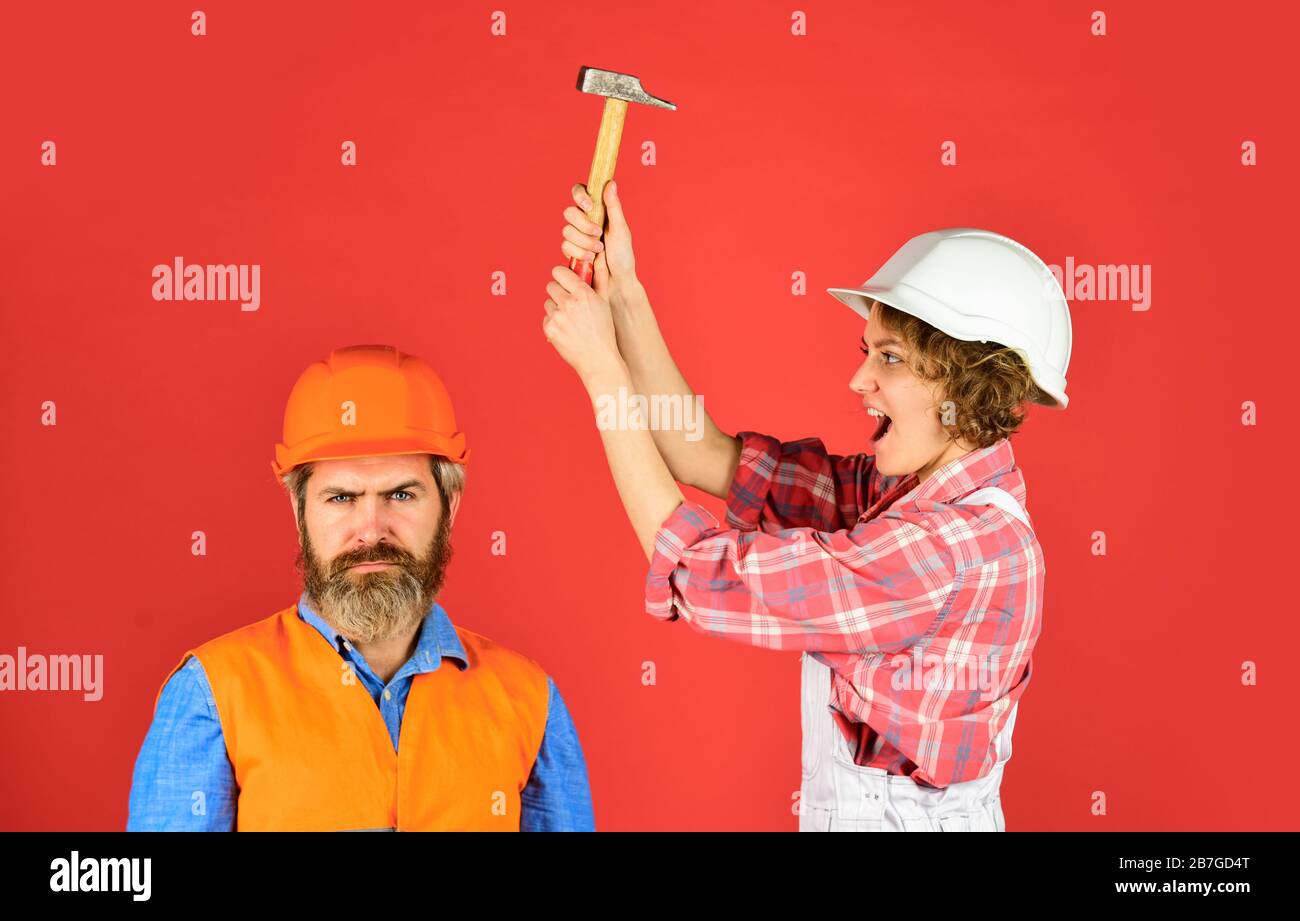 Couple making repair at home. Home Renovation. Rub in. Couple knocking ...