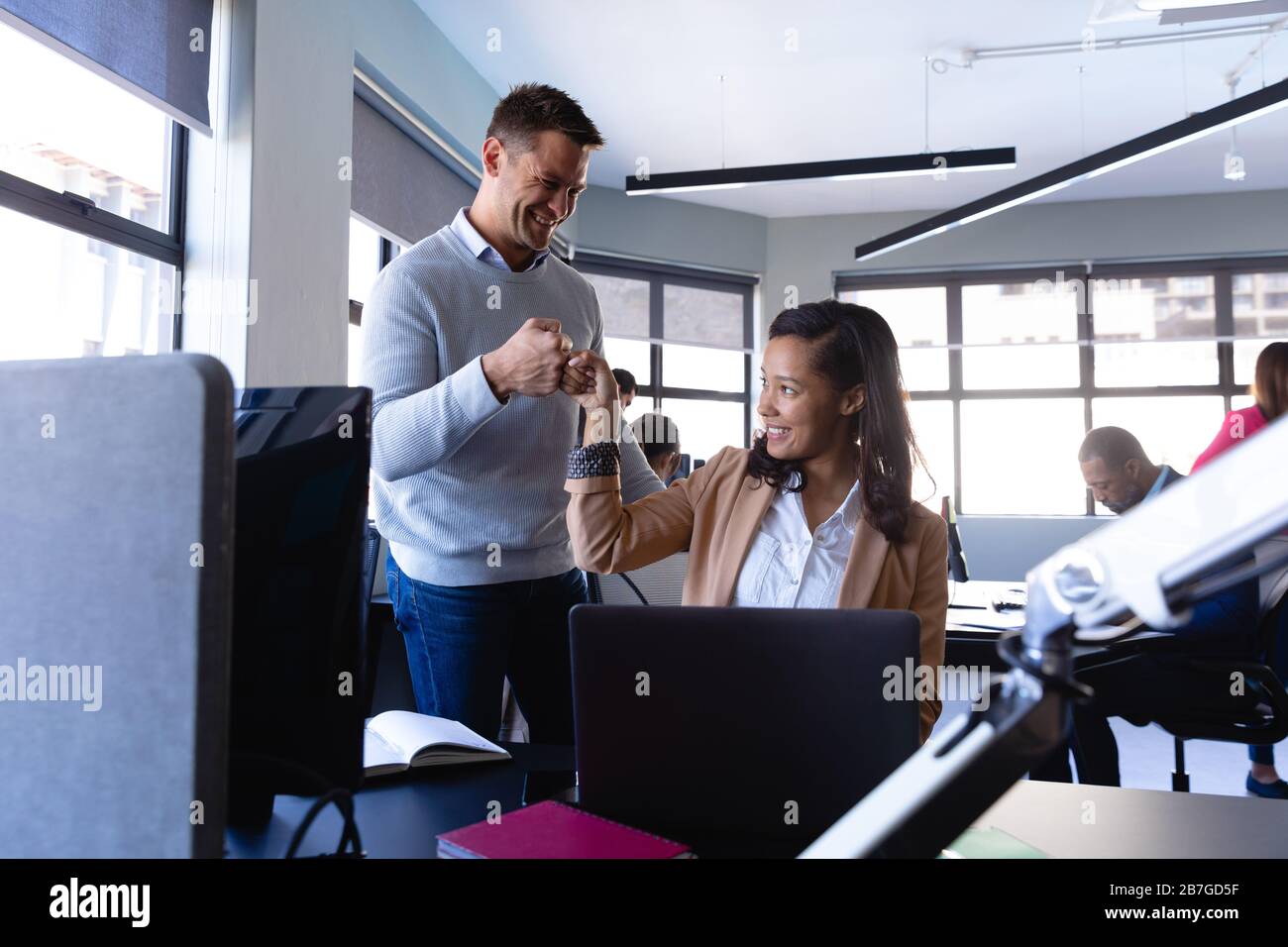 Business people giving a check in office Stock Photo - Alamy