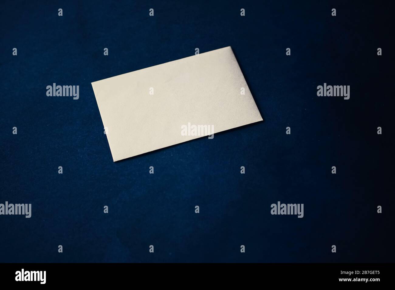 Blank beige paper card on blue background, premium business and luxury ...