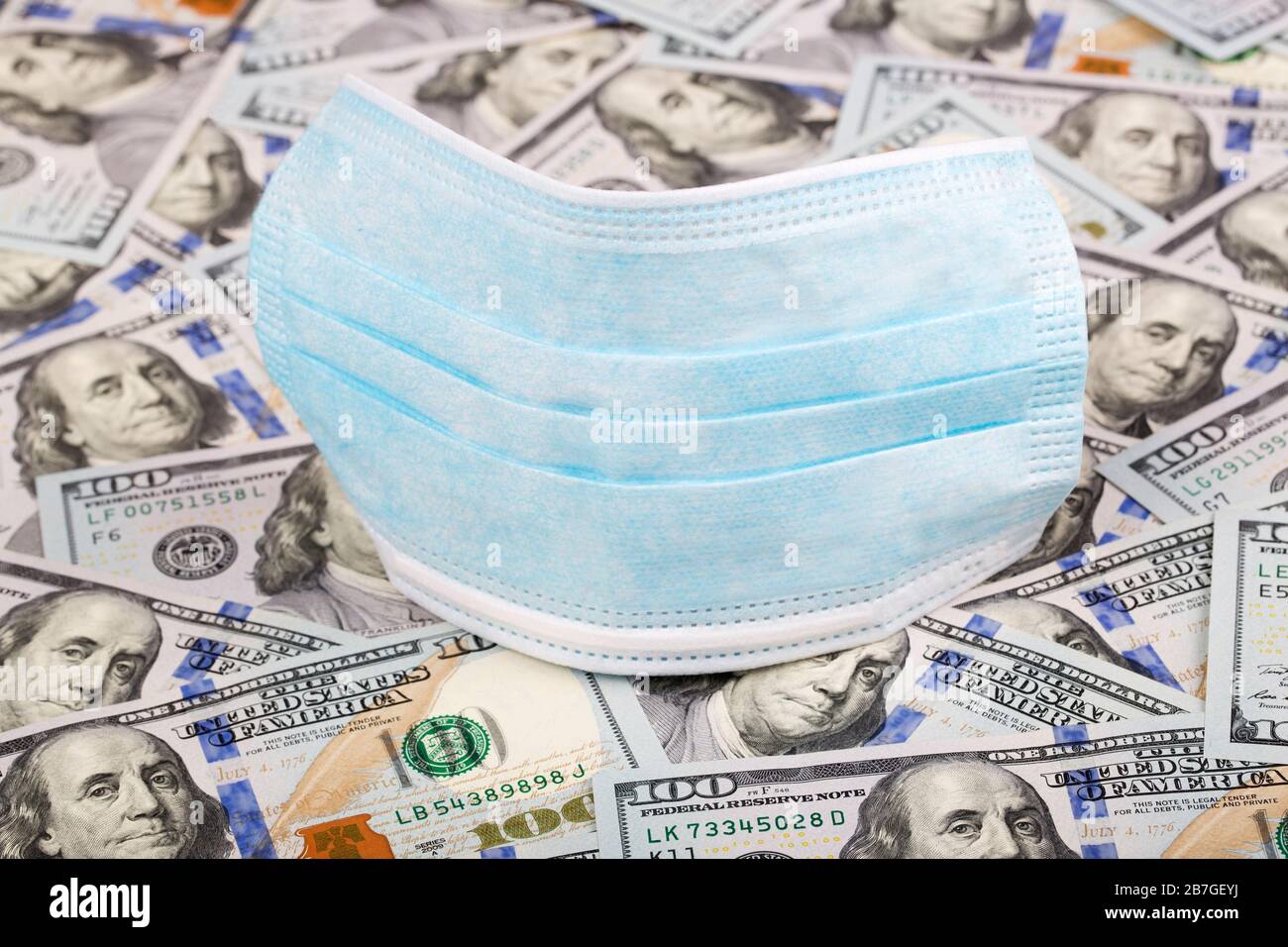 Protective mask on a American Dollars background Stock Photo - Alamy