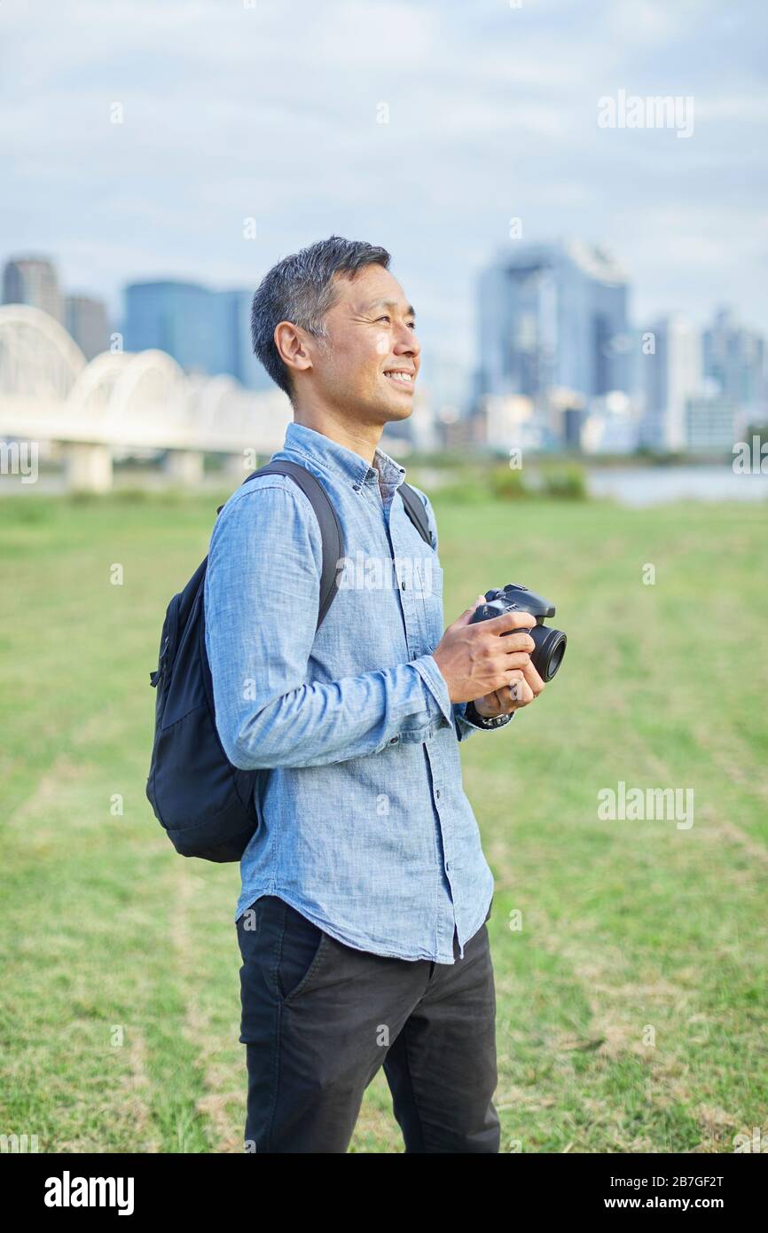 Mature Japanese man downtown Osaka, Japan Stock Photo - Alamy