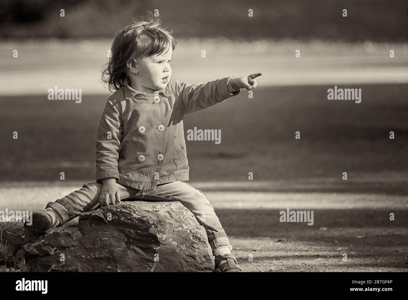 Little girl pointing with finger Stock Photo - Alamy