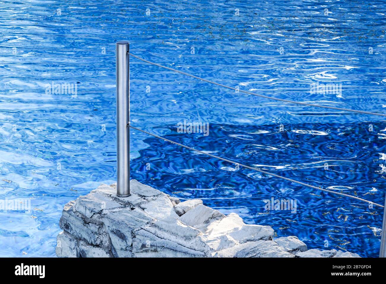 Modern swimming pool with beautiful relaxing blue water, stainless ...