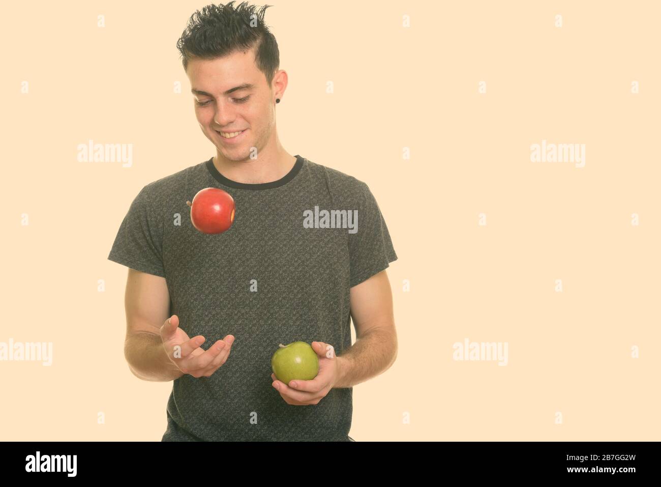 Man throwing apple hi-res stock photography and images - Alamy