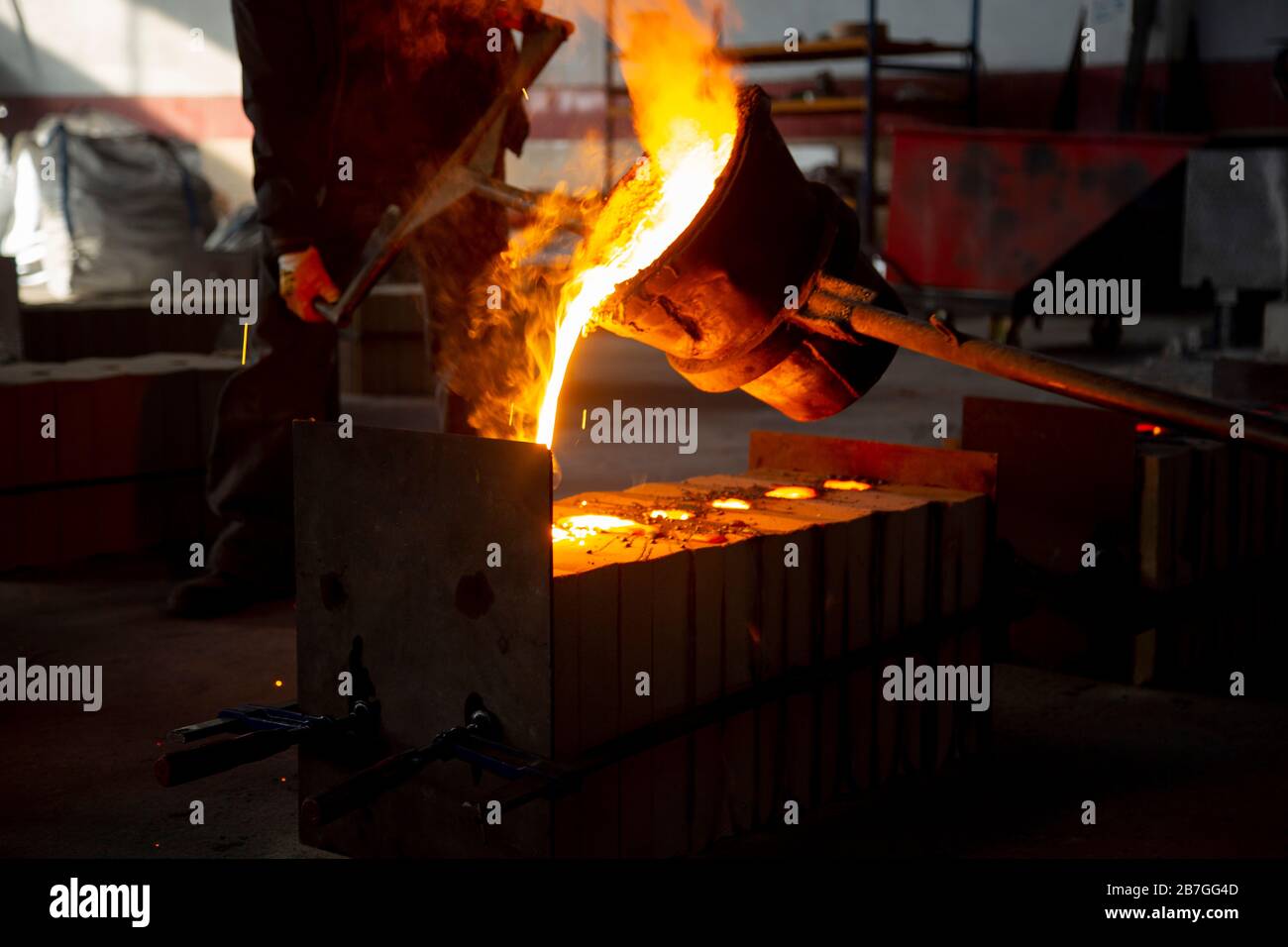 Workers work at the iron casting factory Stock Photo - Alamy