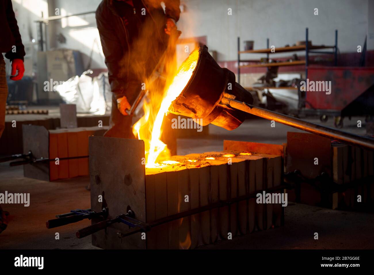 Workers work at the iron casting factory Stock Photo - Alamy