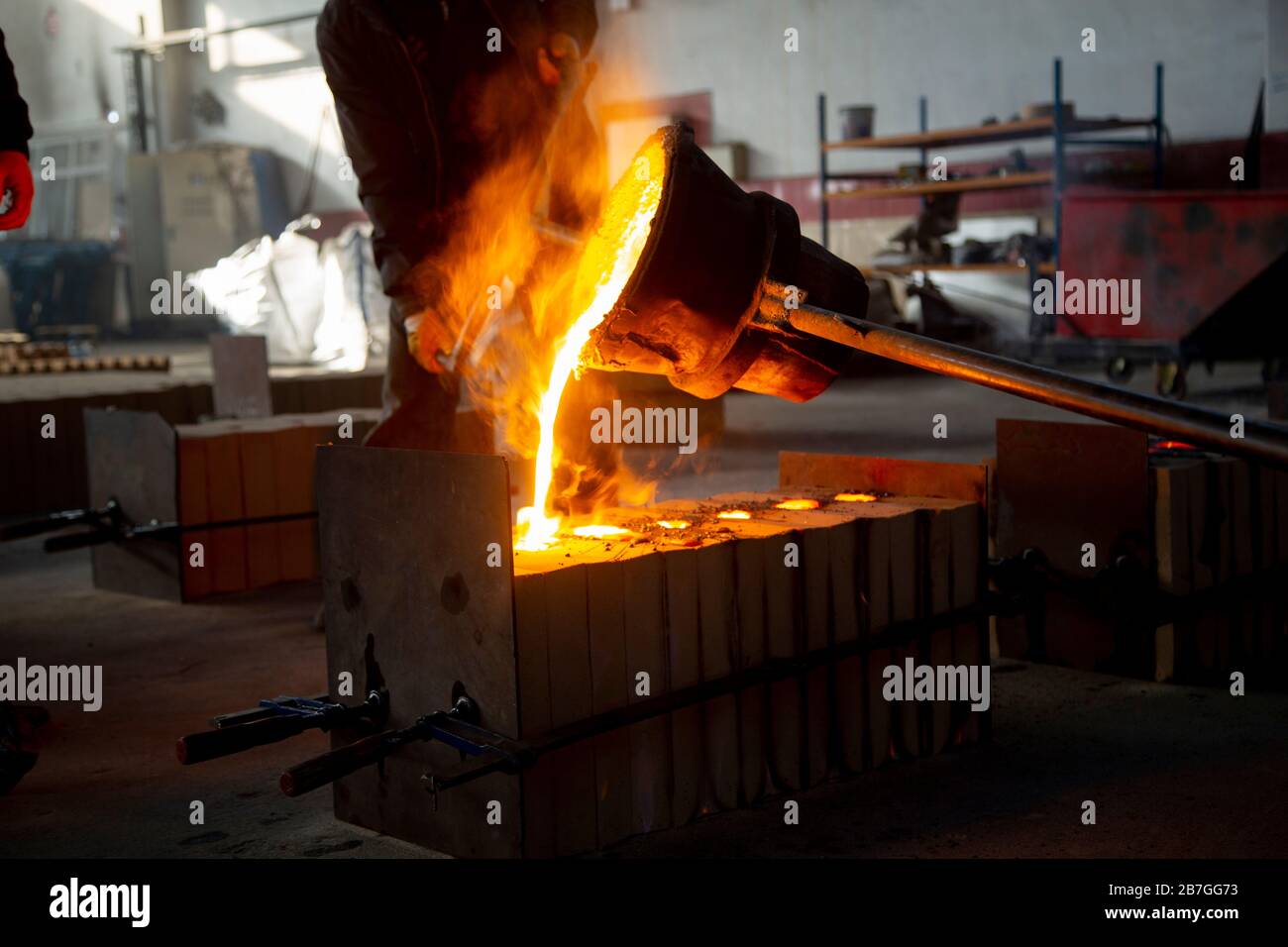 Workers work at the iron casting factory Stock Photo - Alamy