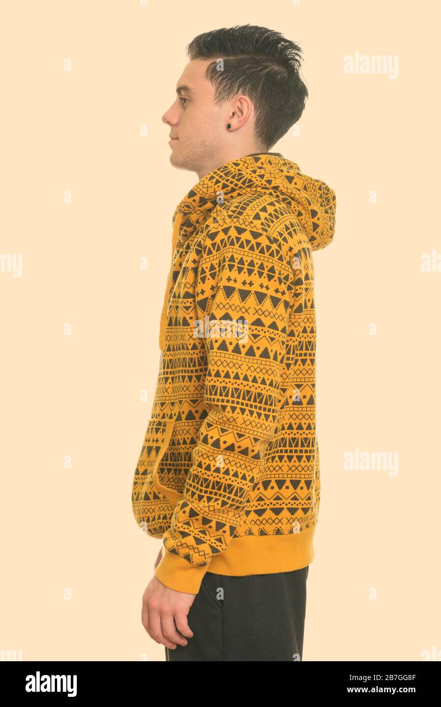 Profile view of young man standing Stock Photo - Alamy