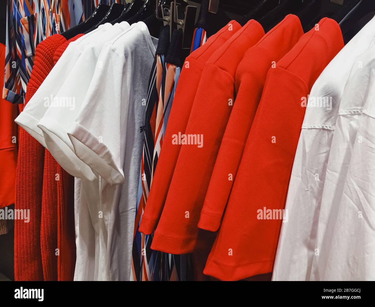 Clothing on display in a boutique store in shopping mall, fast fashion ...