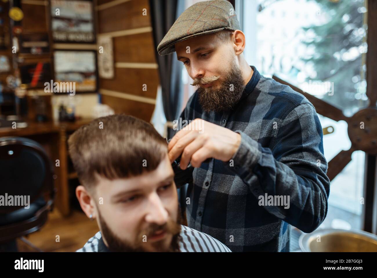 Barber cuts hair client hi-res stock photography and images - Alamy