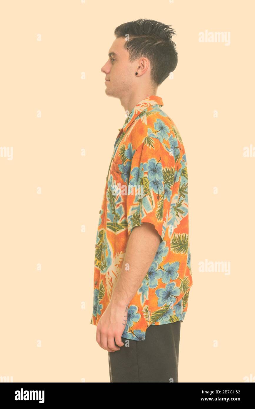 Profile view of young man standing Stock Photo - Alamy