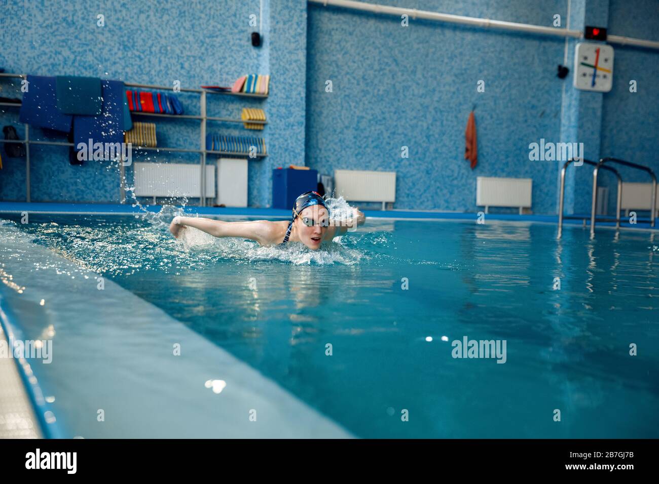 Female swimmer swimming on her back in pool Stock Photo - Alamy