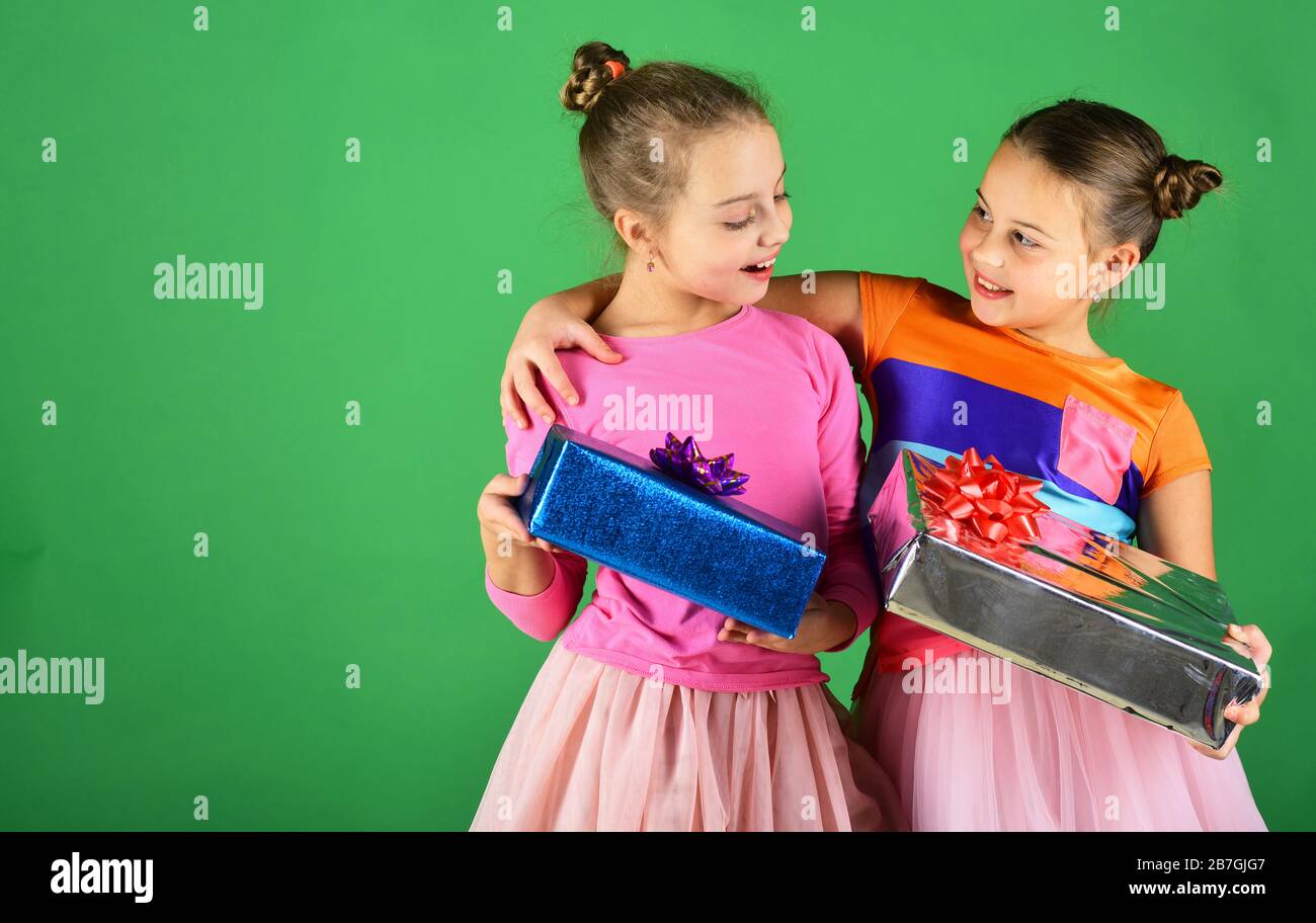 Birthday surprise concept. Sisters with wrapped gift boxes for holiday ...