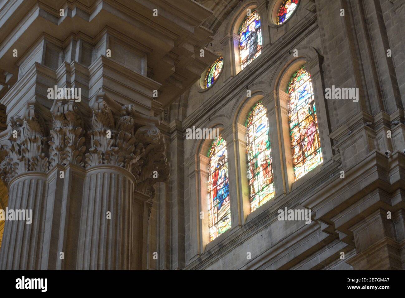 Big pillars and stained glass windows in Malaga Cathedral, Spain Stock ...