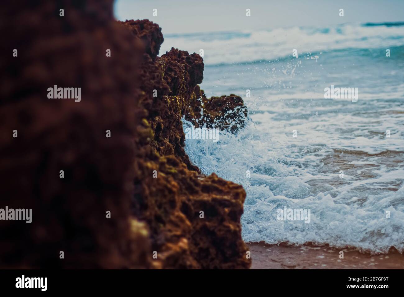 Storm in the ocean, sea waves crashing on rocks on the beach coast ...