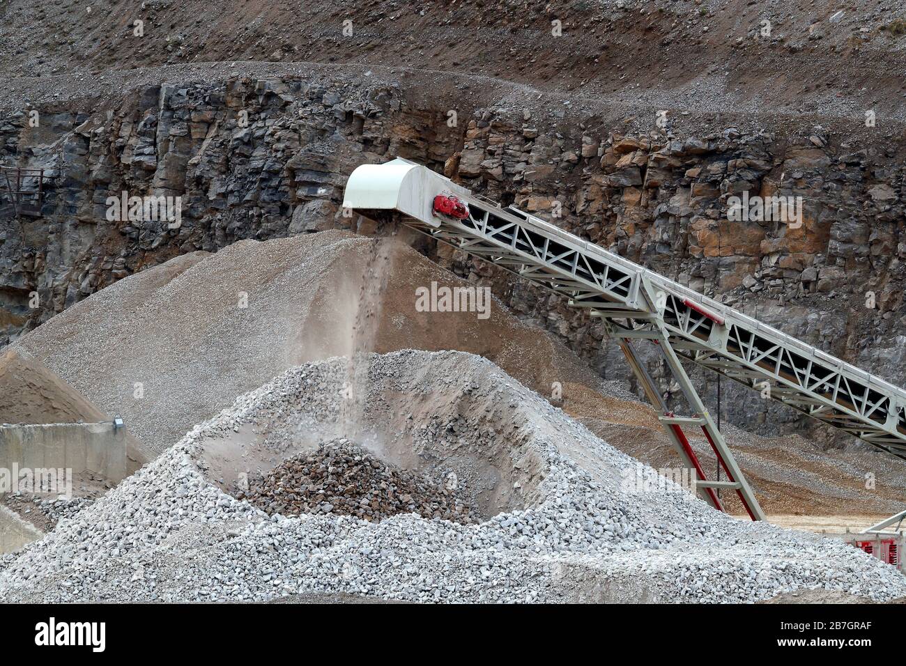 Crushed rock flowing from a conveyer in Coldstones Quarry Greenhow Hill ...