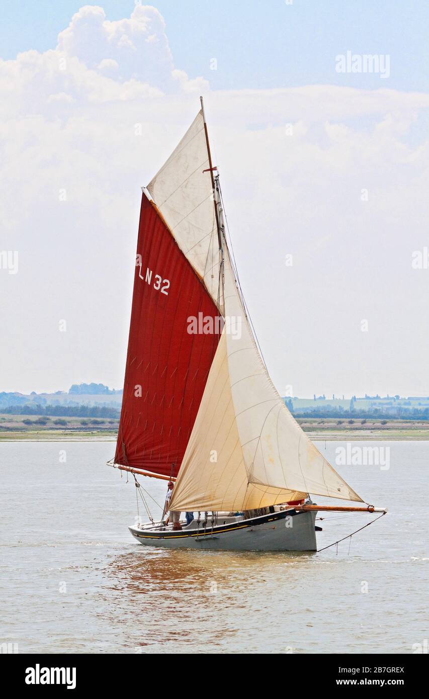 The oyster smack LN32 Mermaid, in full sail Stock Photo - Alamy
