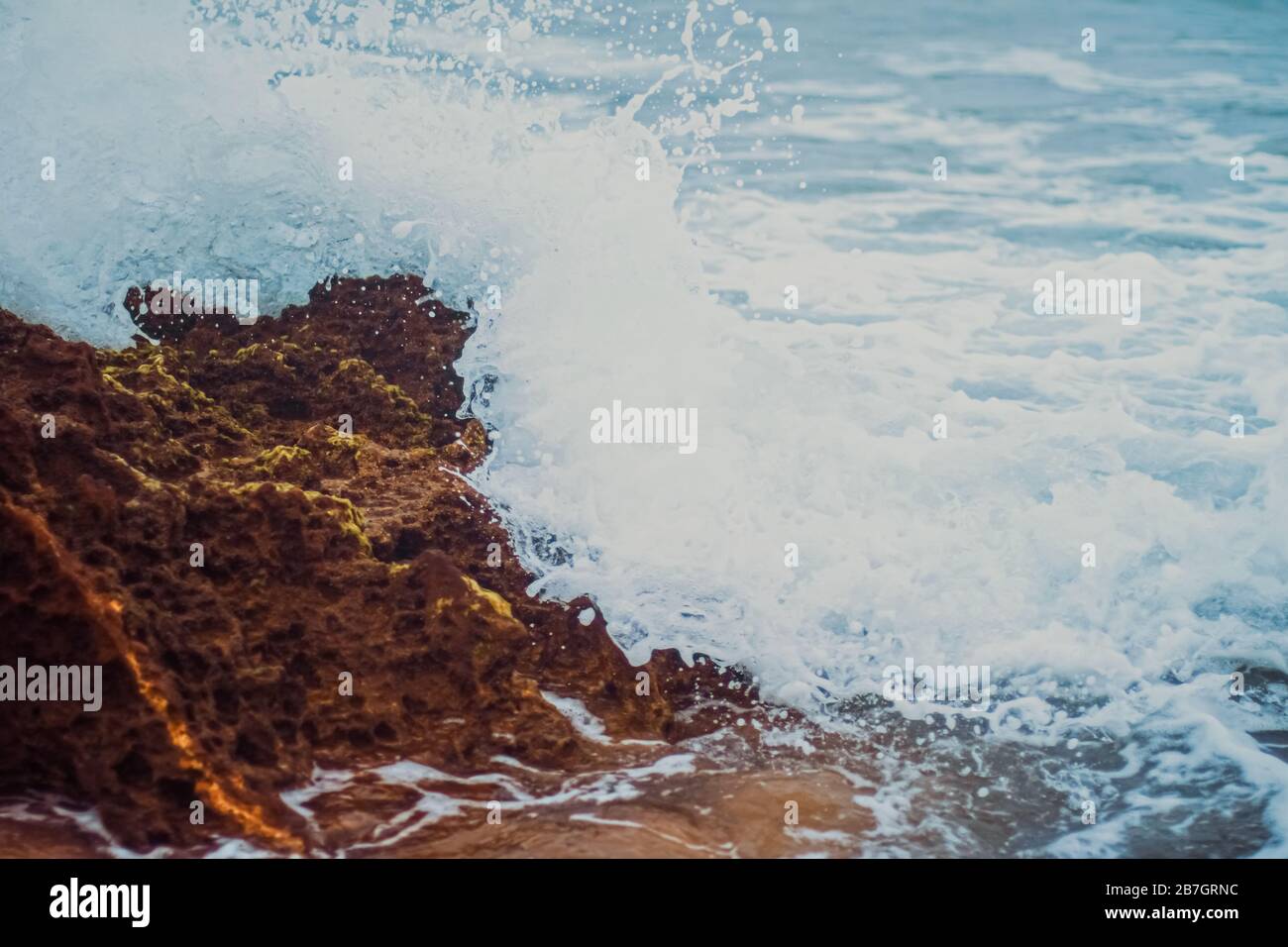 Storm in the ocean, sea waves crashing on rocks on the beach coast ...