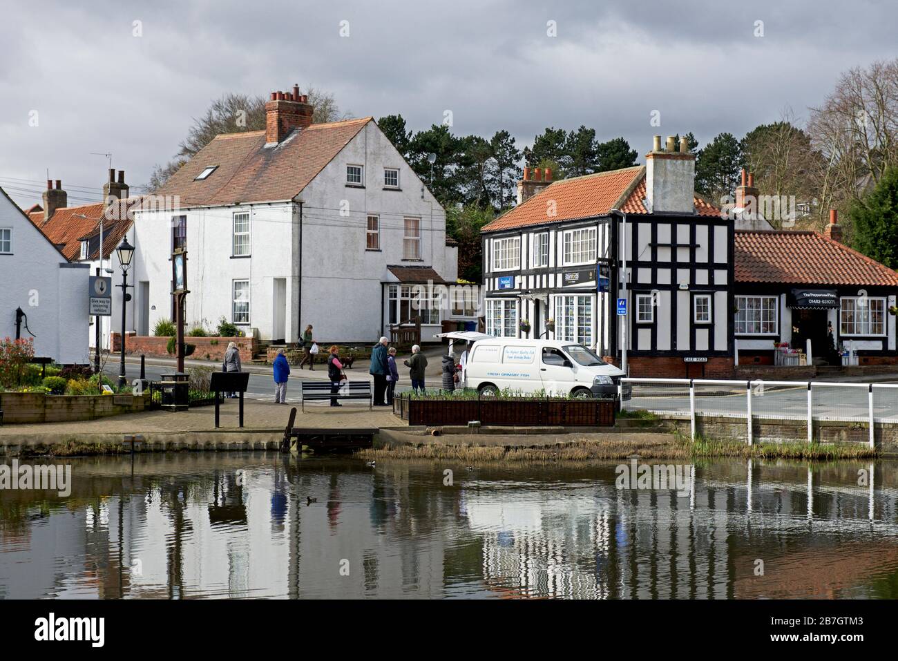 People queueing up at mobile fish van in the village of Swanland, East ...