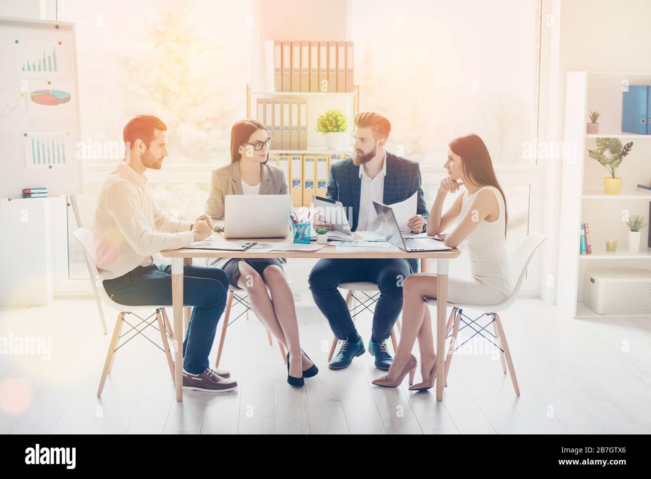 Group of successful young businesspartners are having serious ...