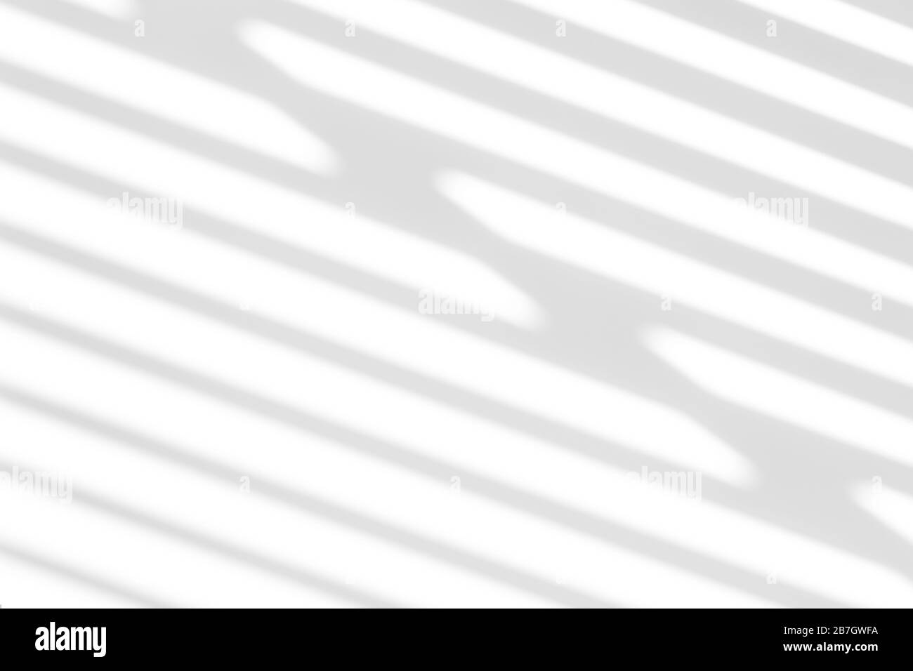 Organic drop shadow on a white wall Stock Photo - Alamy