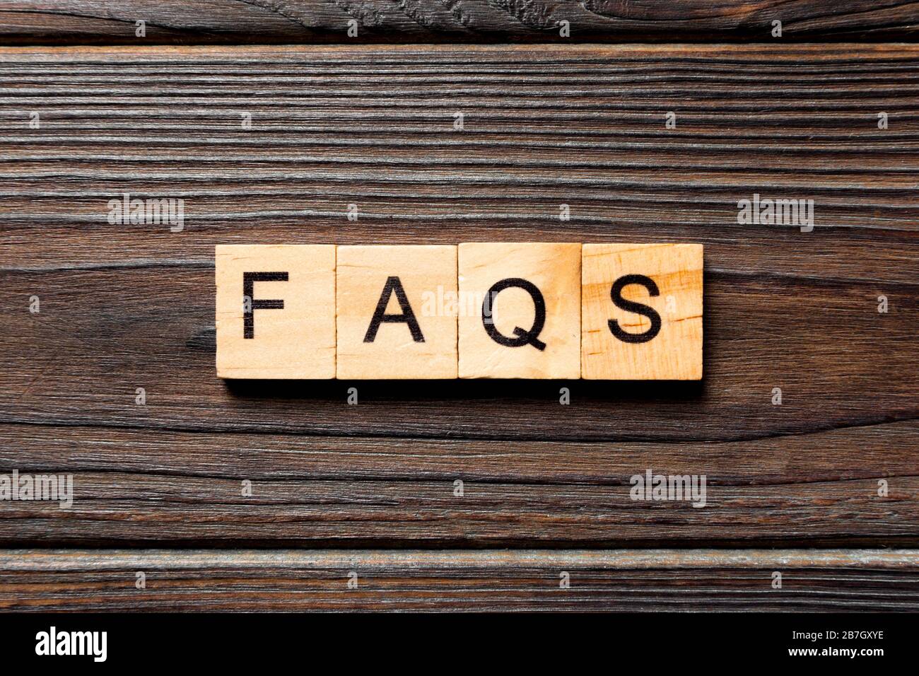 faqs word written on wood block. faqs text on table, concept Stock ...
