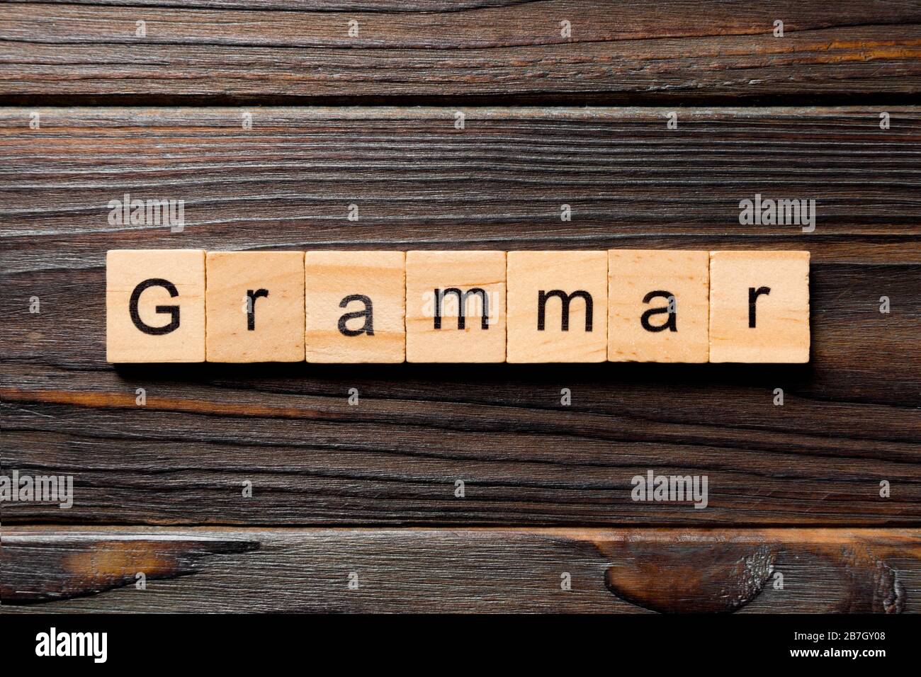 grammar word written on wood block. grammar text on table, concept ...