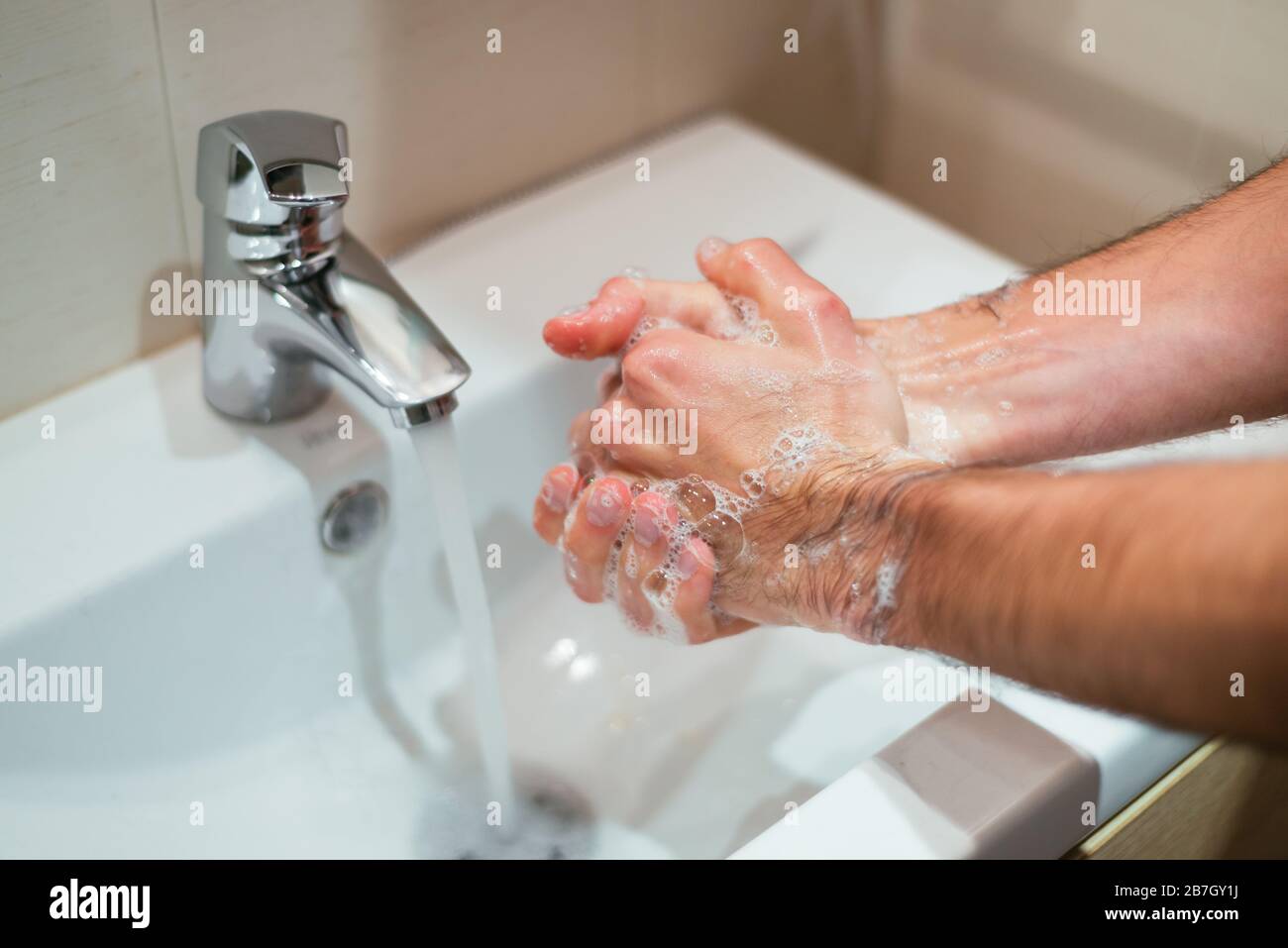Man washing his hands. Close up Stock Photo - Alamy