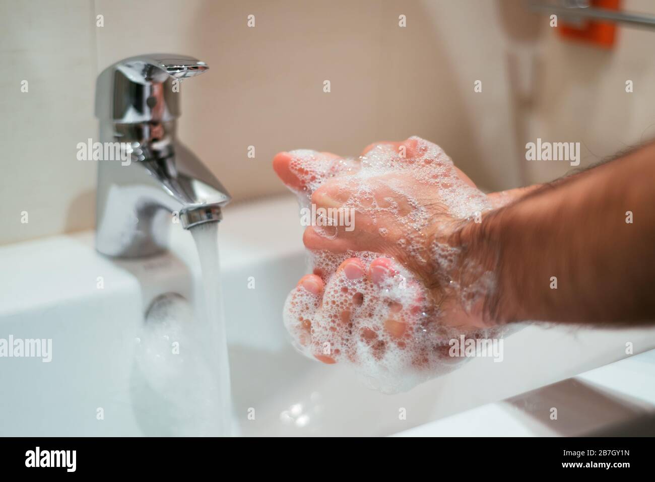 Man washing hands hi-res stock photography and images - Alamy