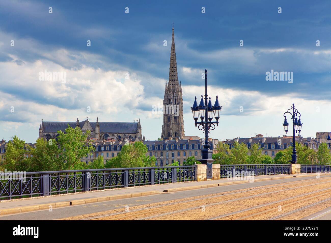 Basilica of Saint Michael and Pont de Pierre in Bordeaux Stock Photo ...